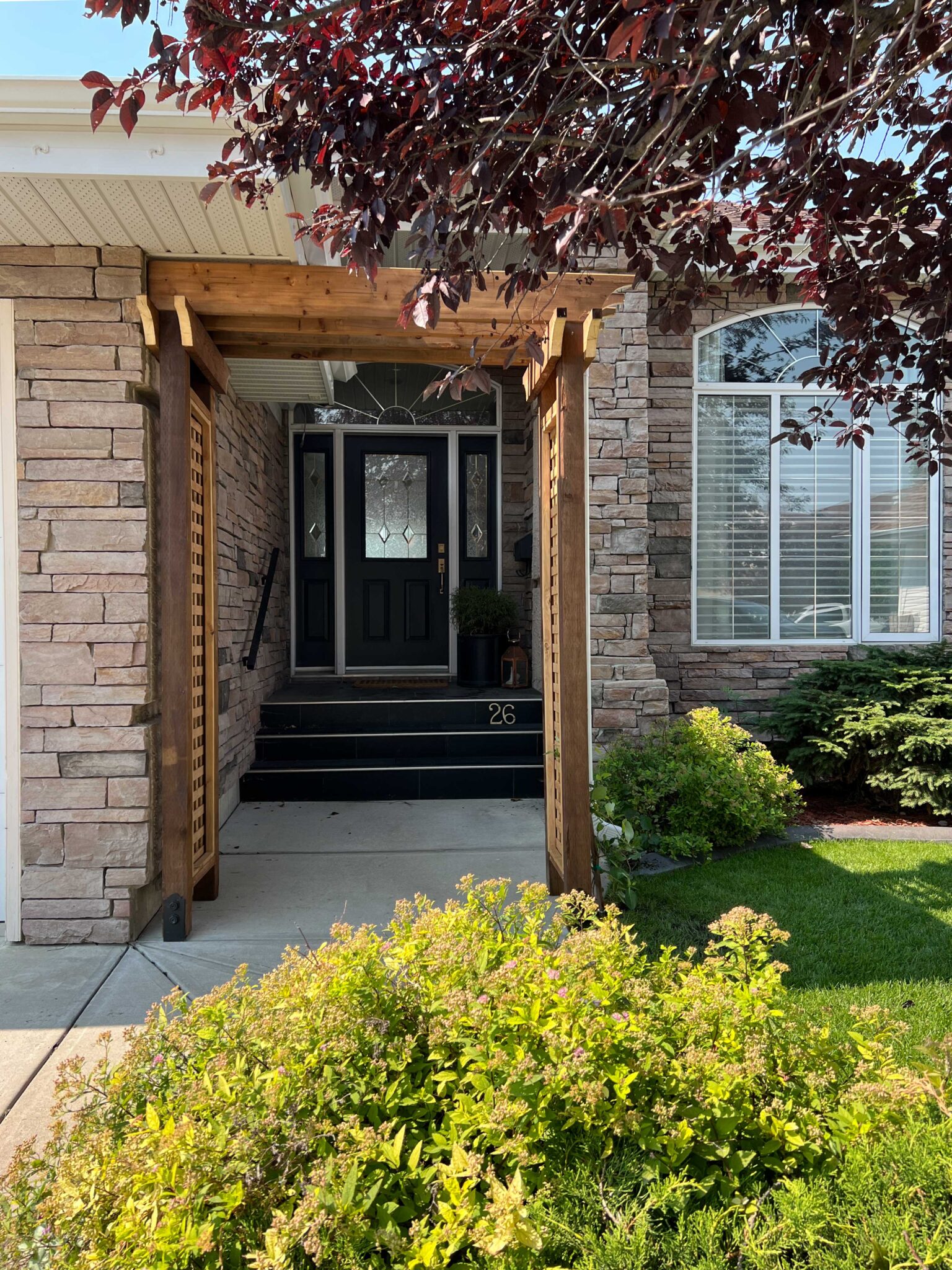 How to Build a Simple DIY Walkway Arch Trellis (With Plans) - Erin ...